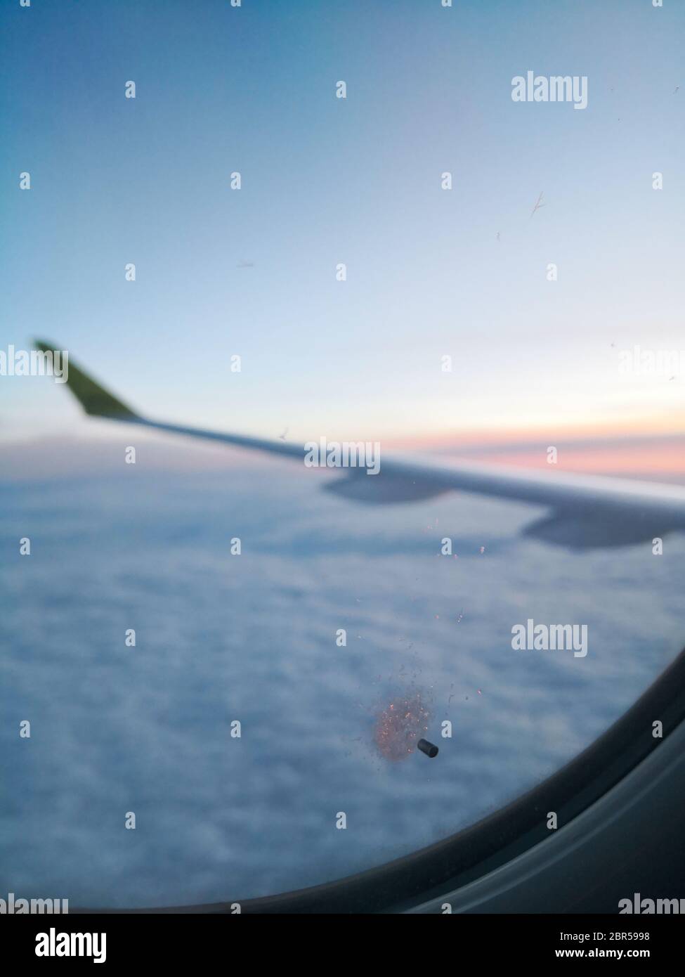 Color close up shot of a little hole in the window of a passenger ...