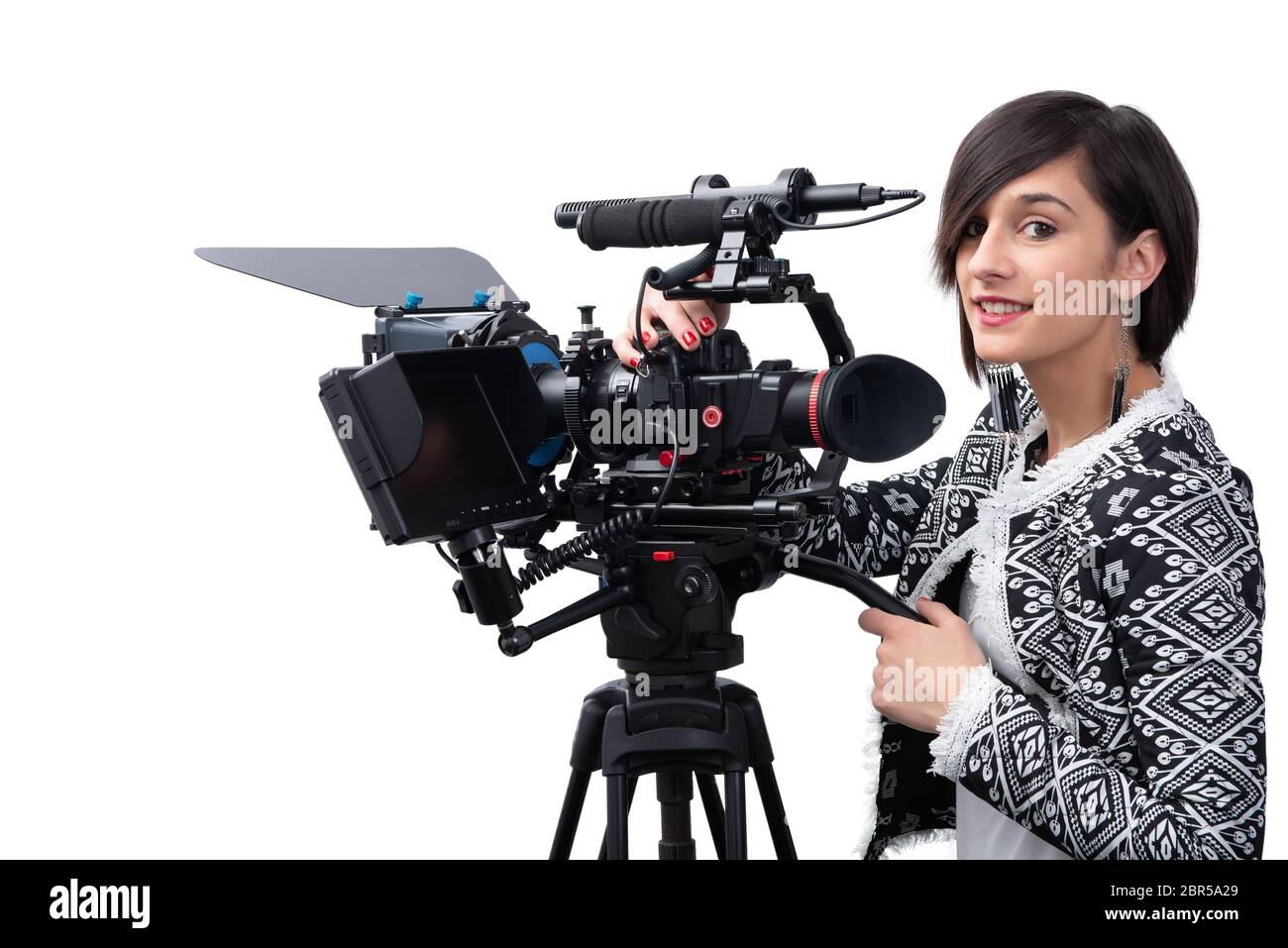 young woman with professional video camera, DSLR, isolated on white ...