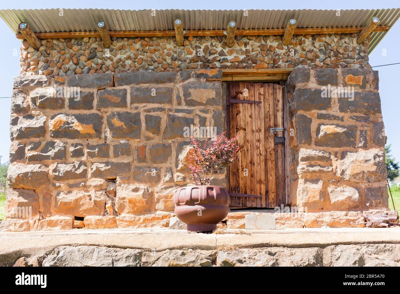 Stone store building of granite river stones for mountain weather ...