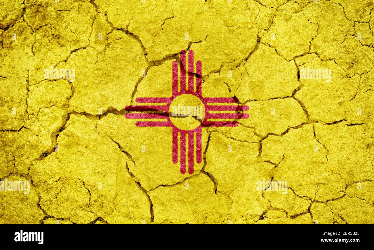 Flag of the U.S. state of New Mexico on dry earth ground texture ...