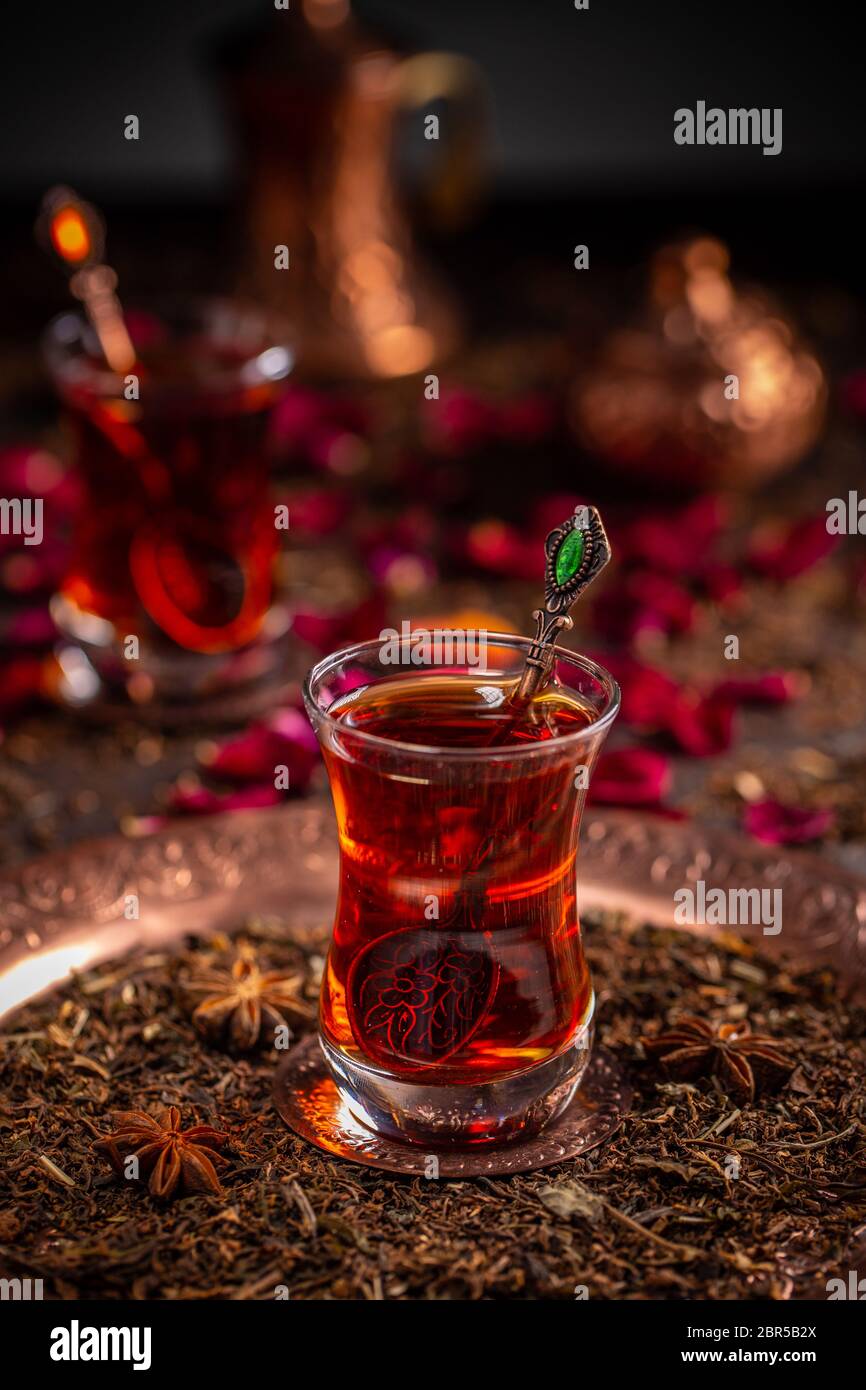 Turkish tea served in the typical manner, in a glass on a small saucer ...