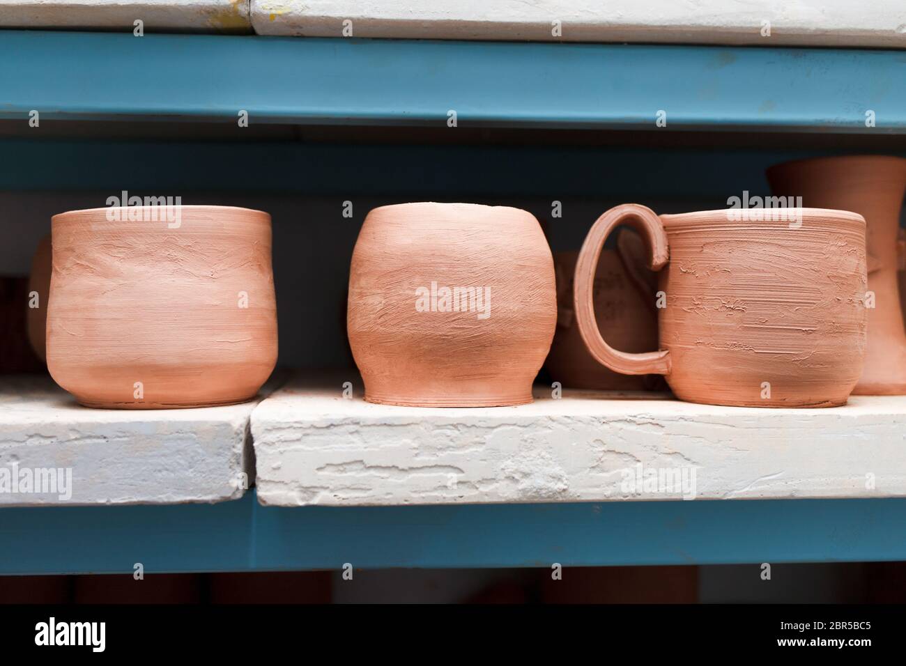 Many different ceramic items on store shelves Stock Photo - Alamy