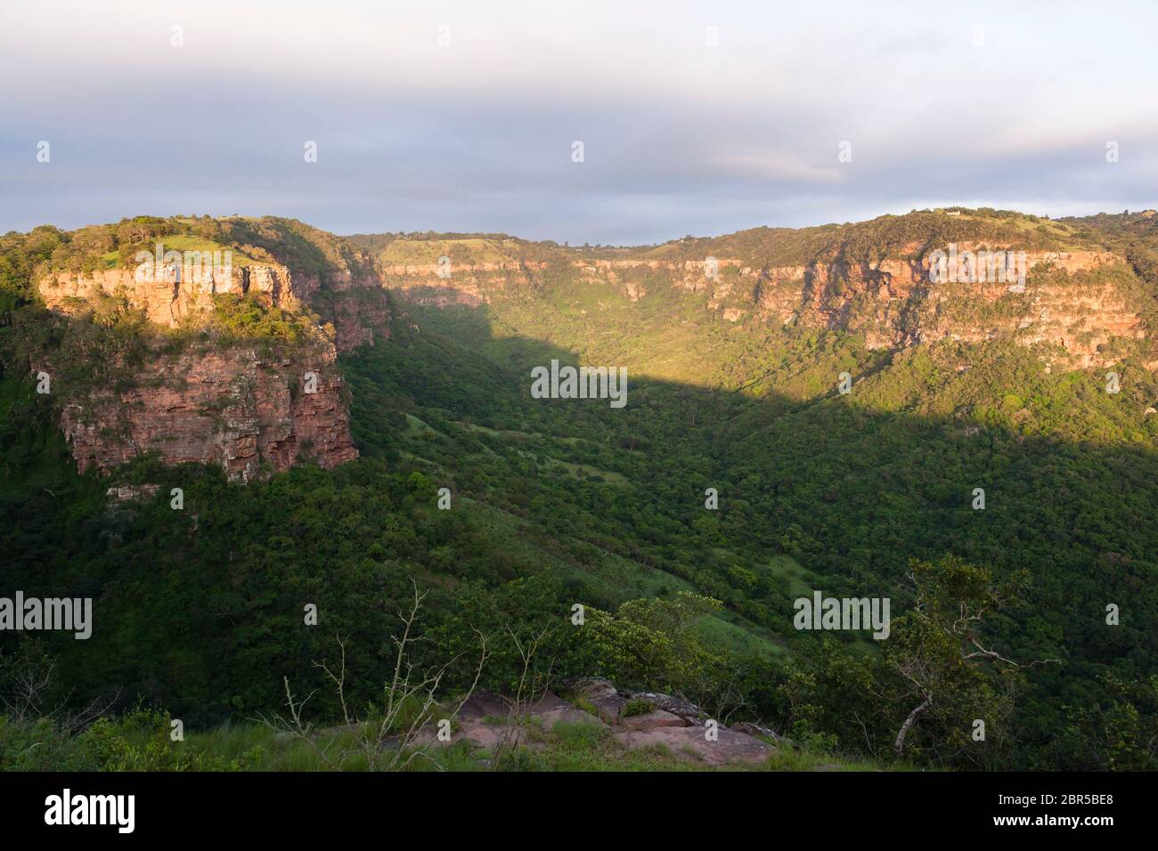Wilderness hiking valley between rocky cliffs Stock Photo - Alamy