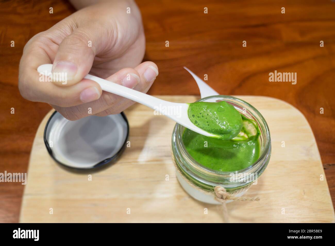 Hand on matcha green tea mousse dessert, stock photo Stock Photo - Alamy