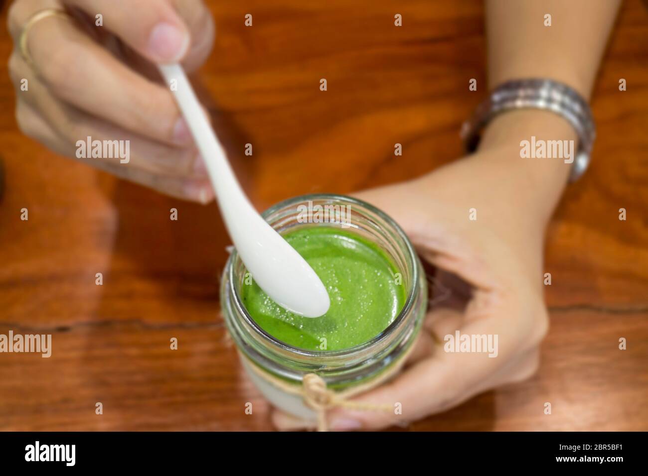 Hand on matcha green tea mousse dessert, stock photo Stock Photo - Alamy