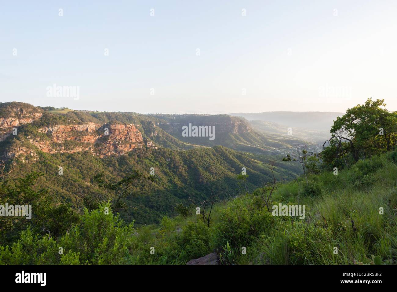 Wilderness hiking valley between rocky cliffs Stock Photo - Alamy