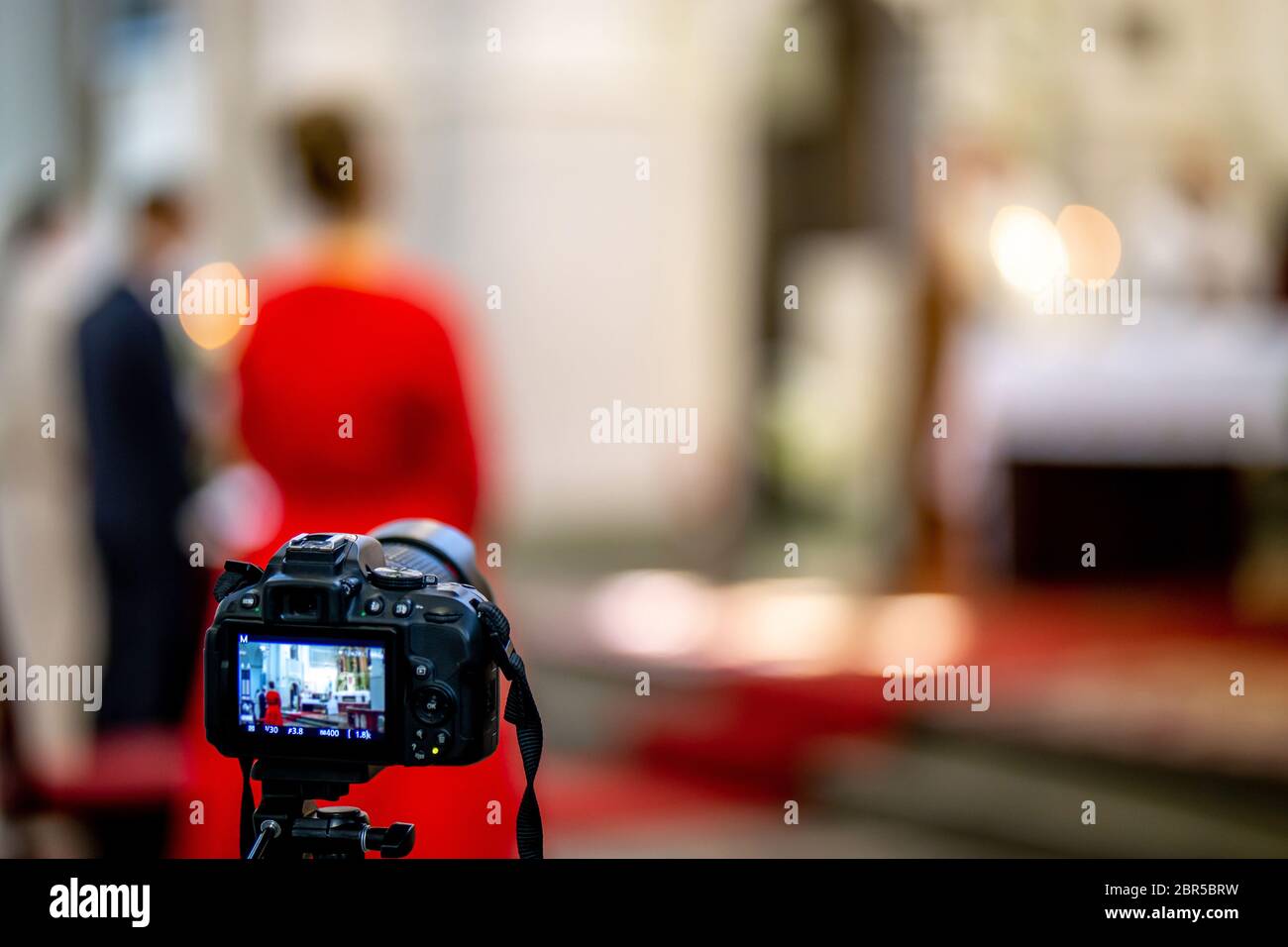 Wedding marriage ceremony in church maked with the photo camera ...