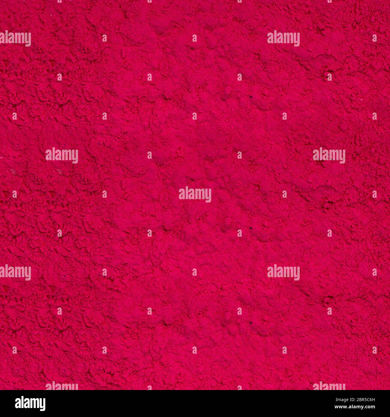 Abstract background of red dry powder paint Stock Photo - Alamy