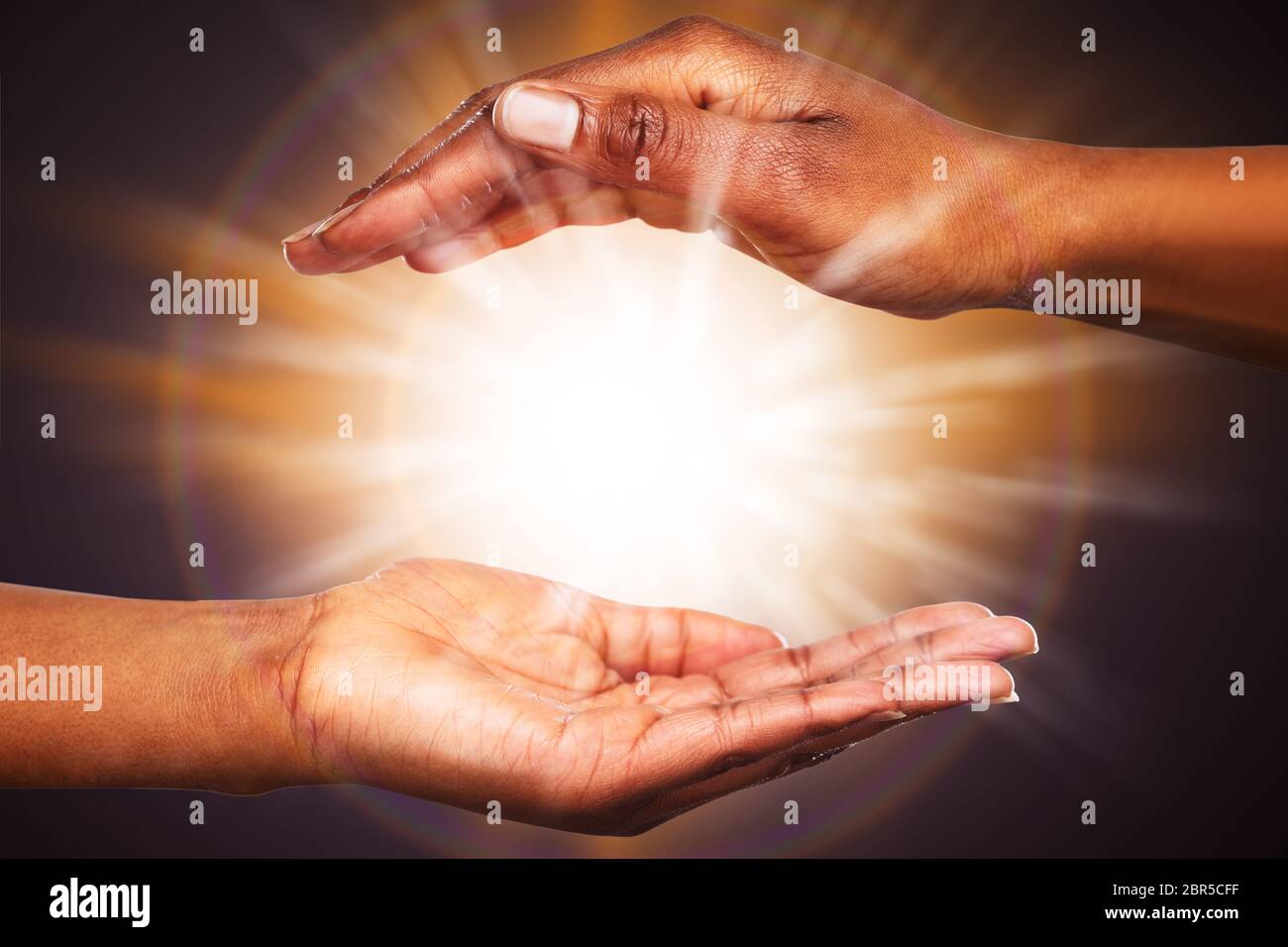 Close-up Of Mysterious Glowing Power In The Hands Stock Photo - Alamy