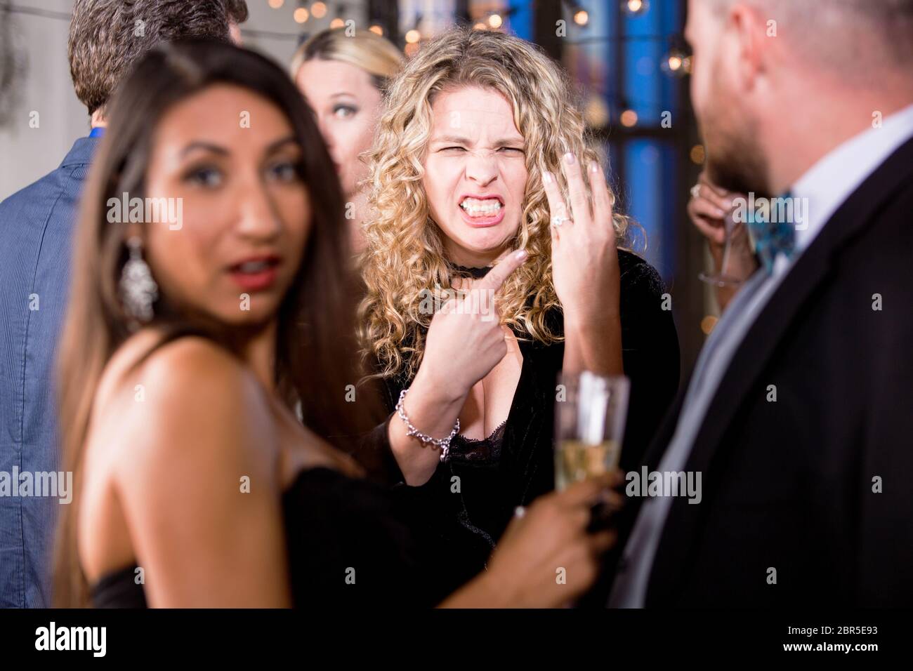 Angry woman screaming and pointing to her wedding ring Stock Photo - Alamy