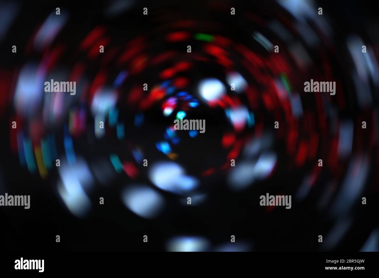 Blurred LED screen closeup. Glowing threads in a color spectrum on a ...