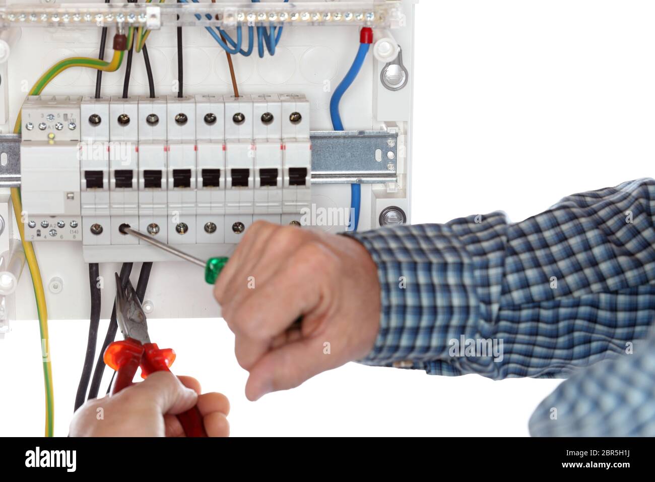 electrician is repairing an electrical circuit with tools Stock Photo ...