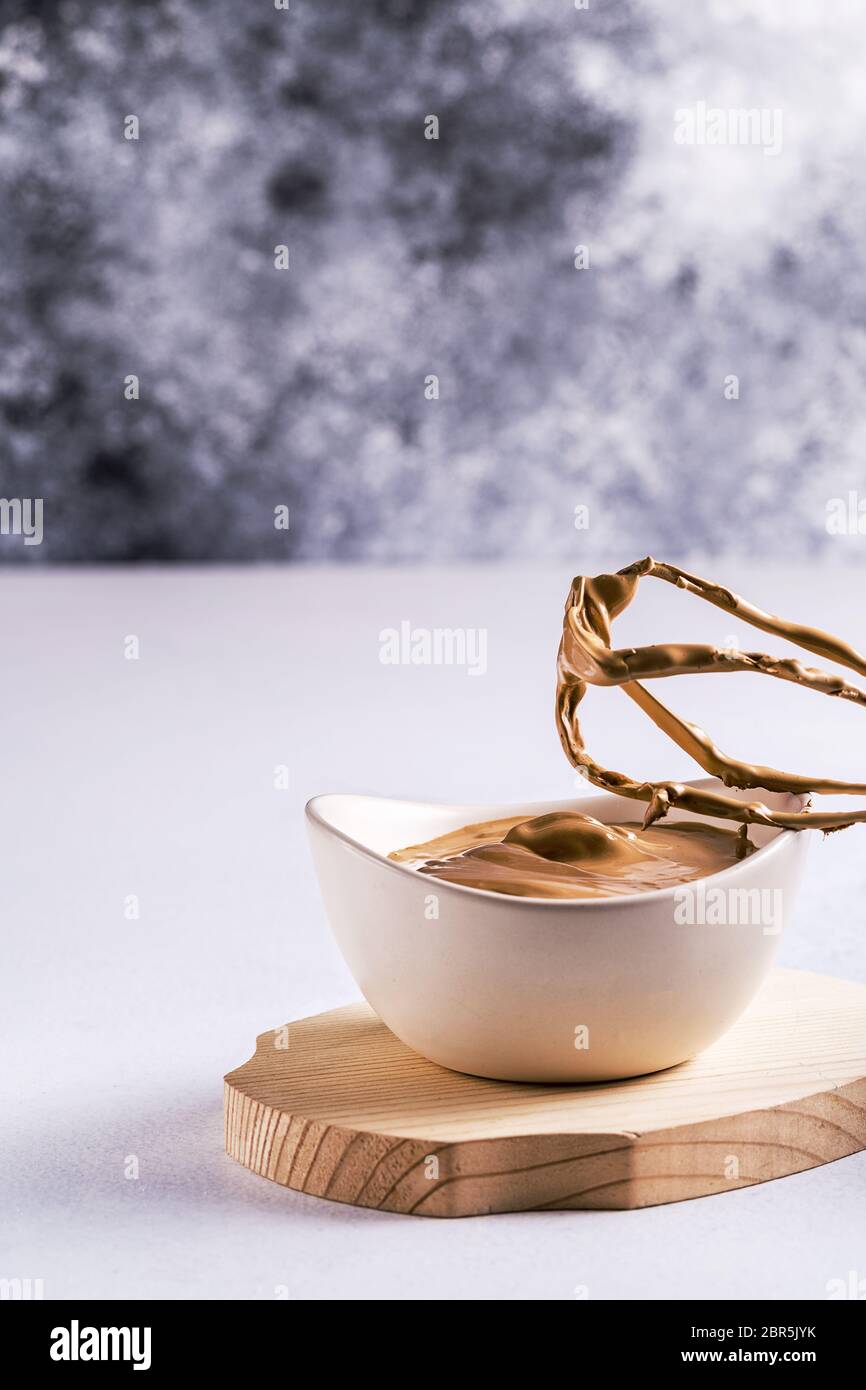 Cooking Dalgona Coffee with whipped foam . Dalgona coffee cream made ...