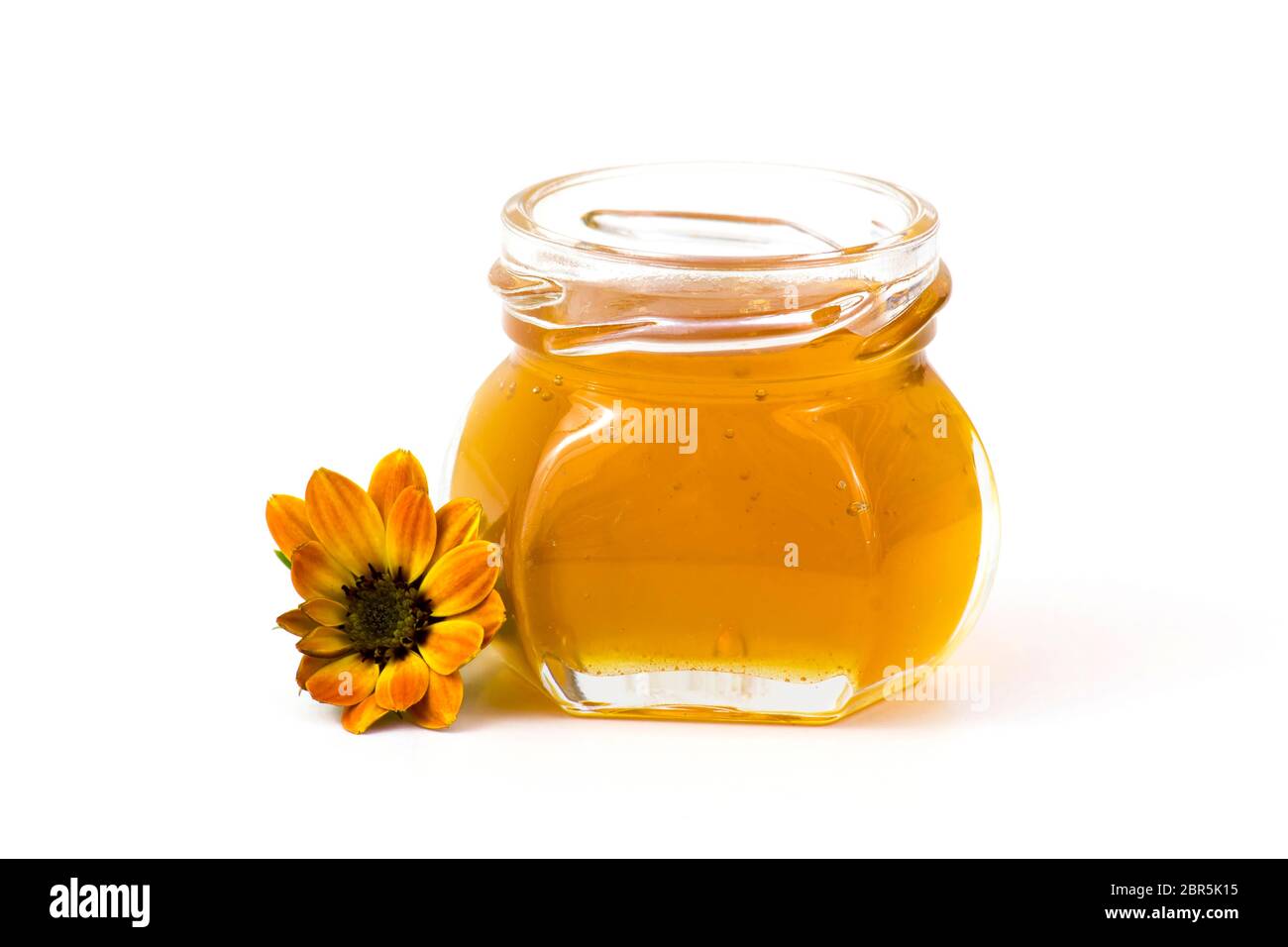 honey and flower on white background Stock Photo - Alamy