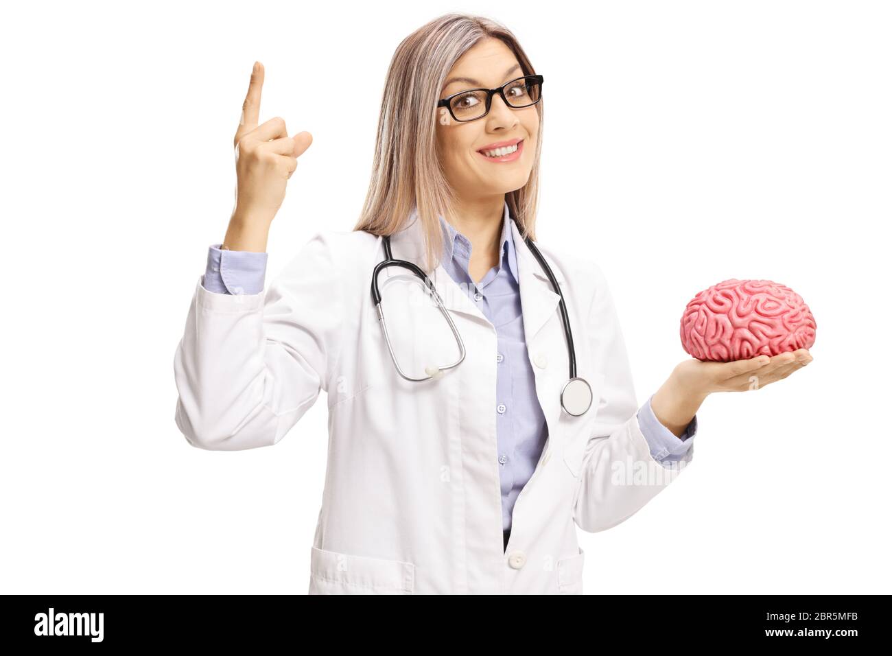 Female doctor holding a brain model and pointing up isolated on white ...