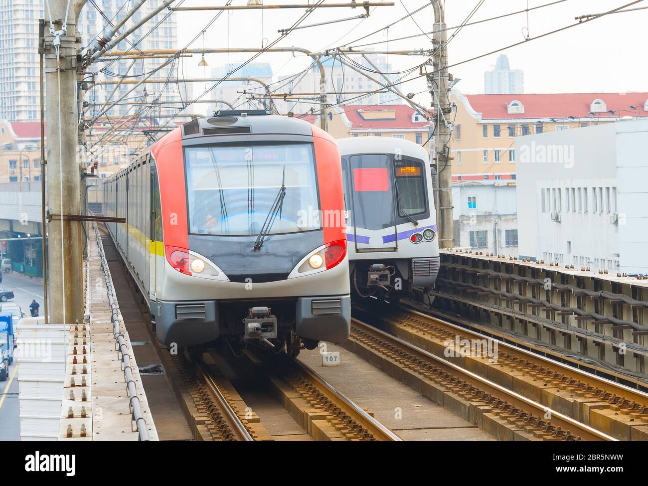 Shanghai metro train leaving an underground station while another train ...