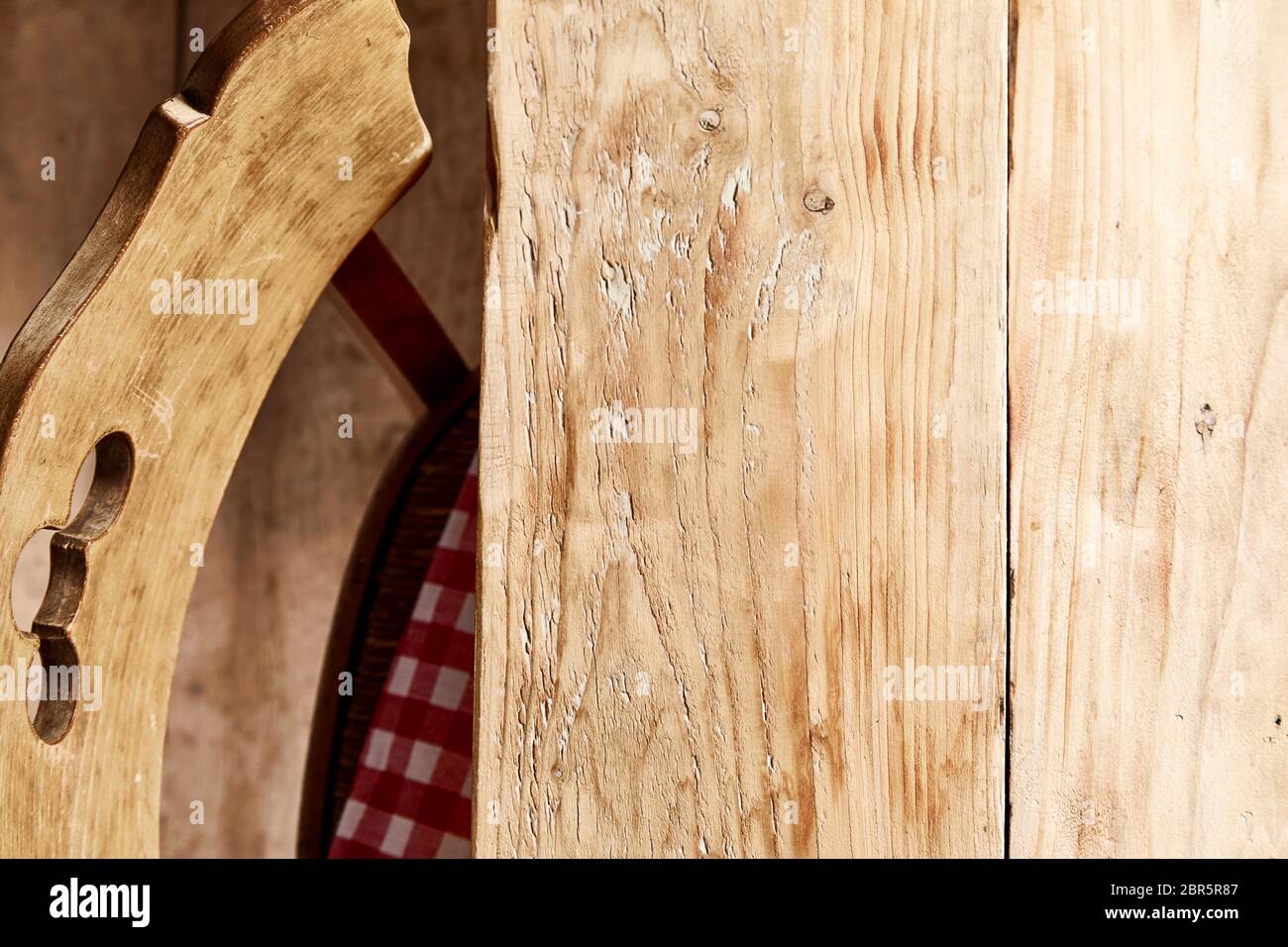 Empty rustic or vintage wood table made of pine planks and chair viewed ...
