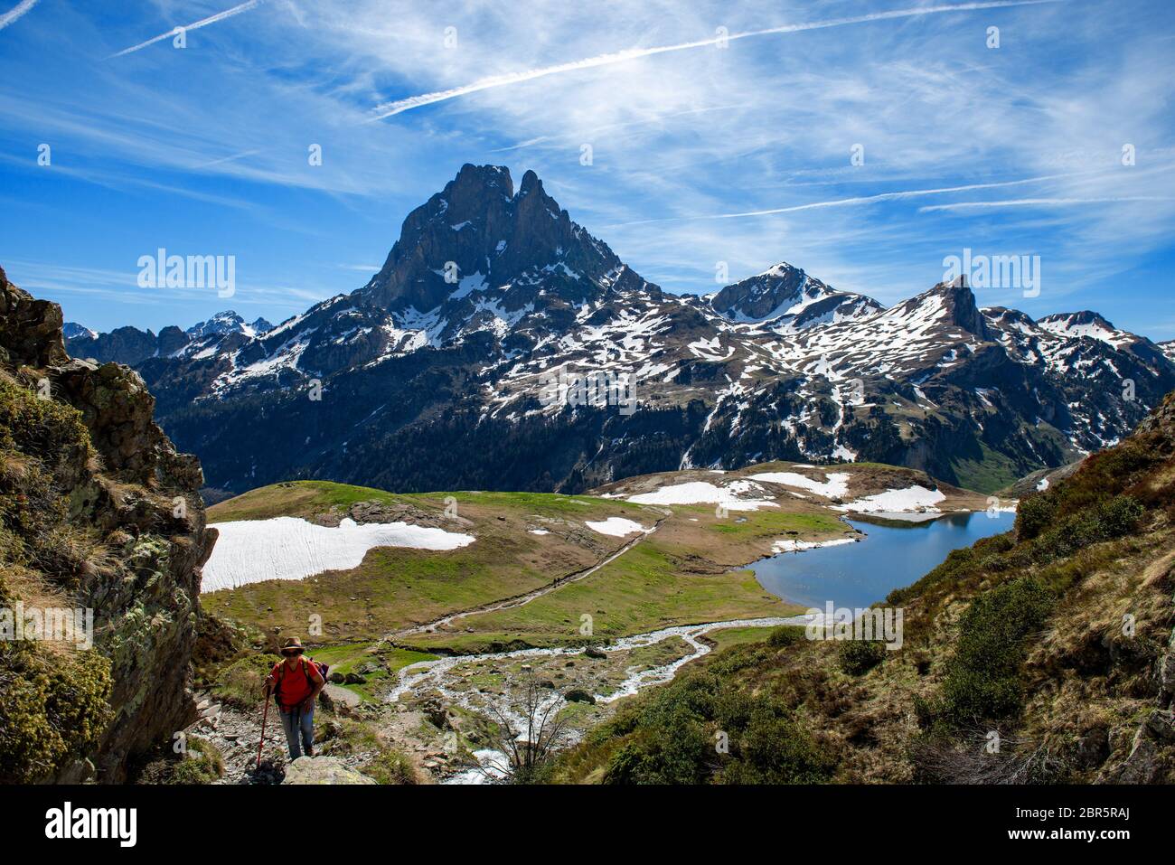 a hiker woman walking in the french Pyrenees mountains, Pic du midi d ...