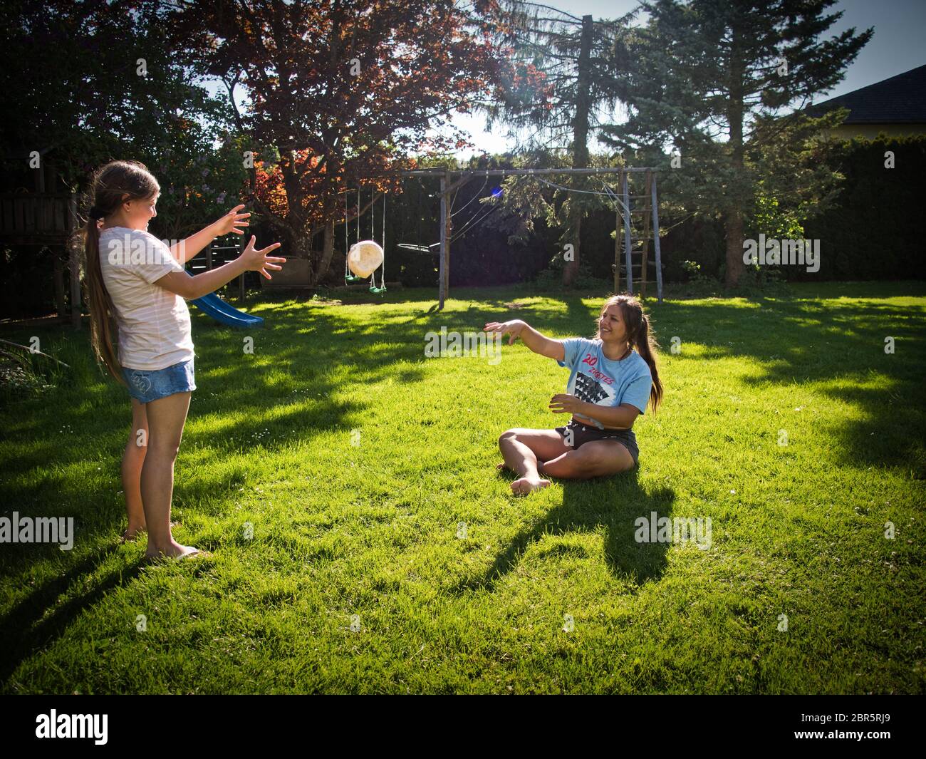 Children playing ball smile hi-res stock photography and images - Alamy