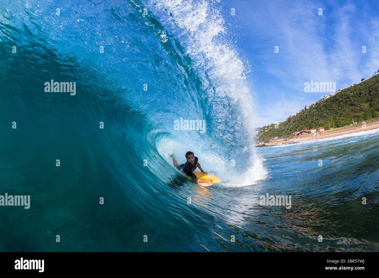 Surfing surfer body-boarder tube rides inside hollow ocean wave Stock ...