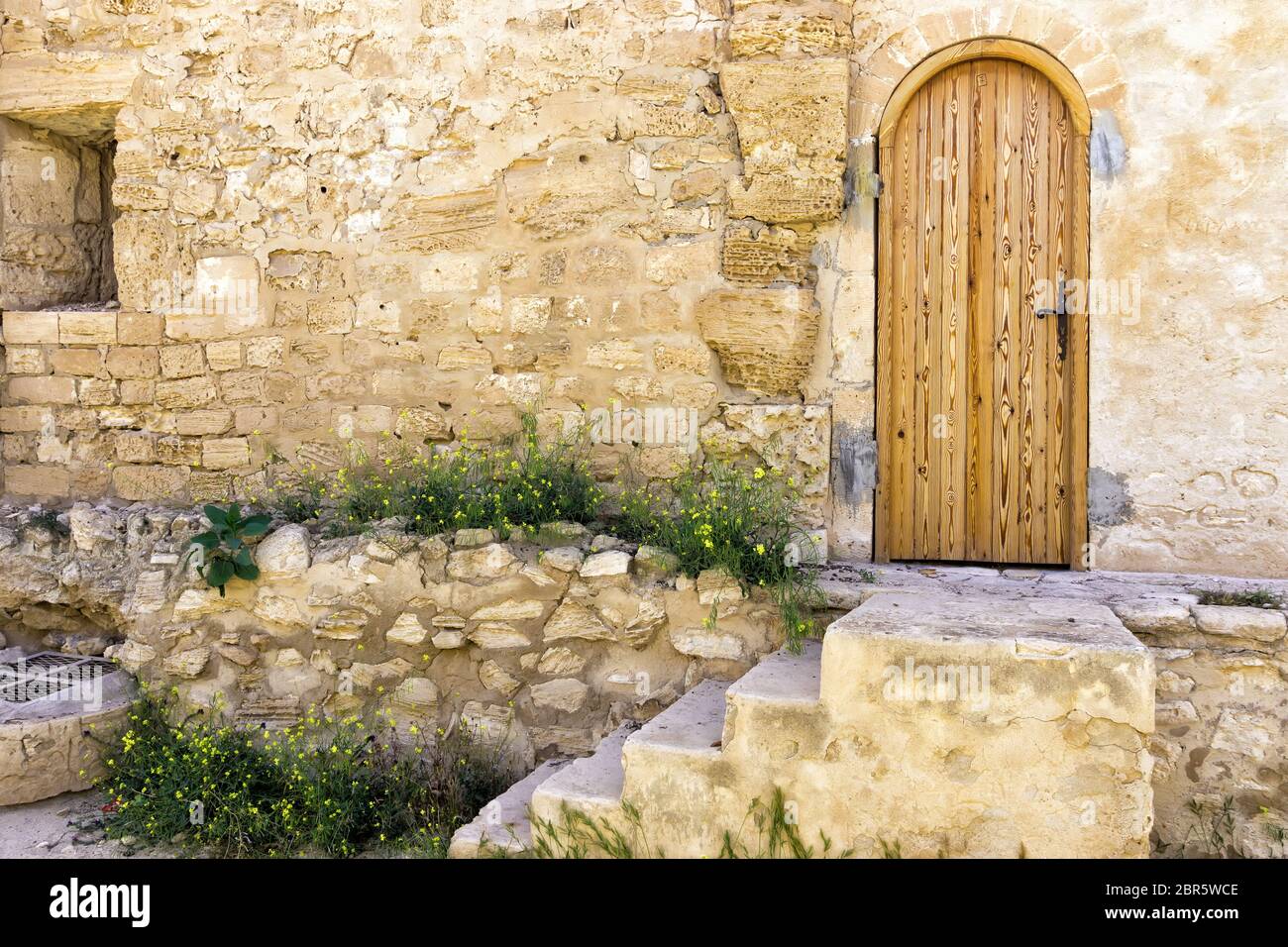 Door in a garden of the Borj el Kebir Castle in Houmt El Souk in Djerba ...