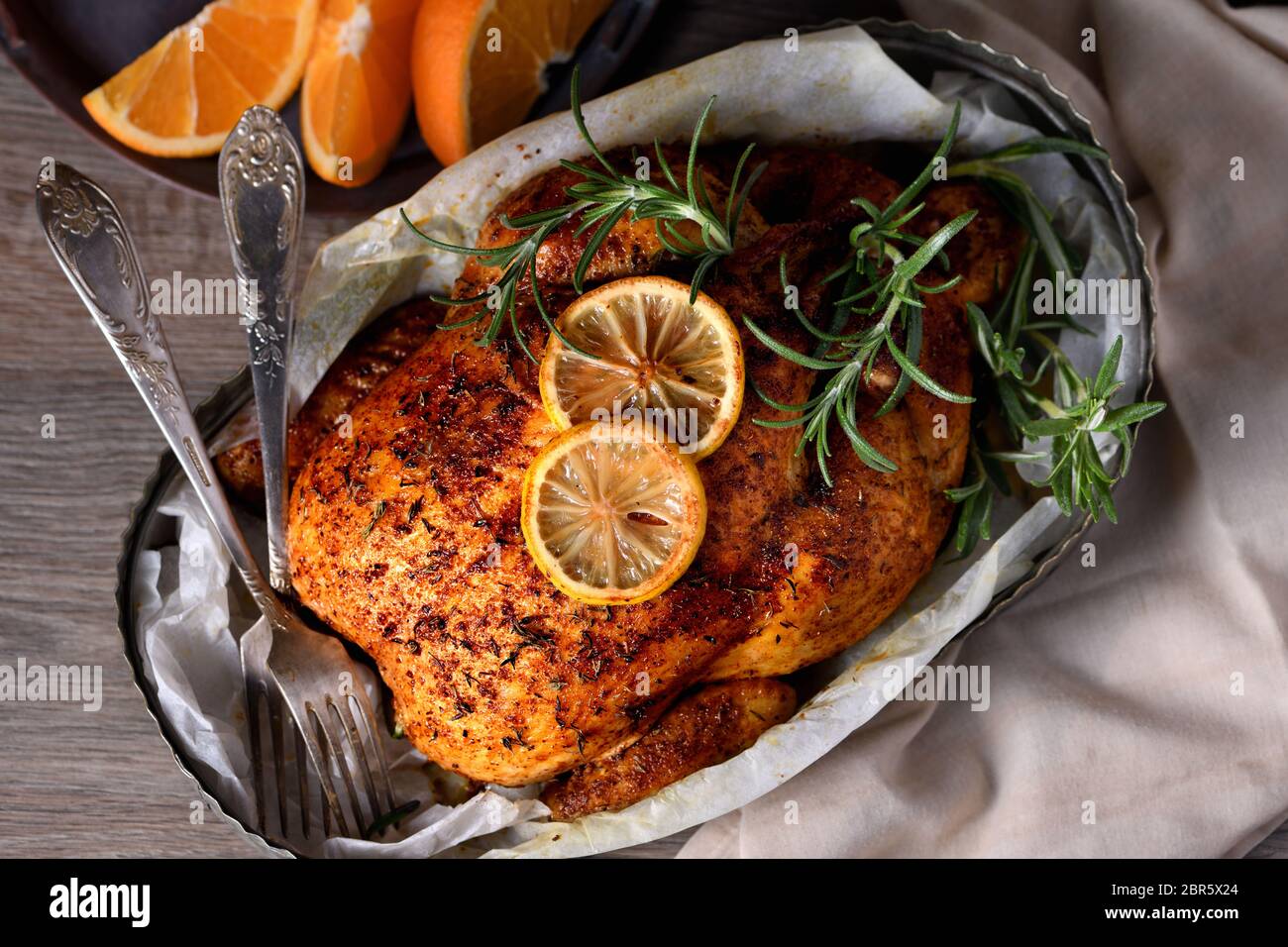 Baked whole chicken in spices with crispy appetizing fried crust in a ...