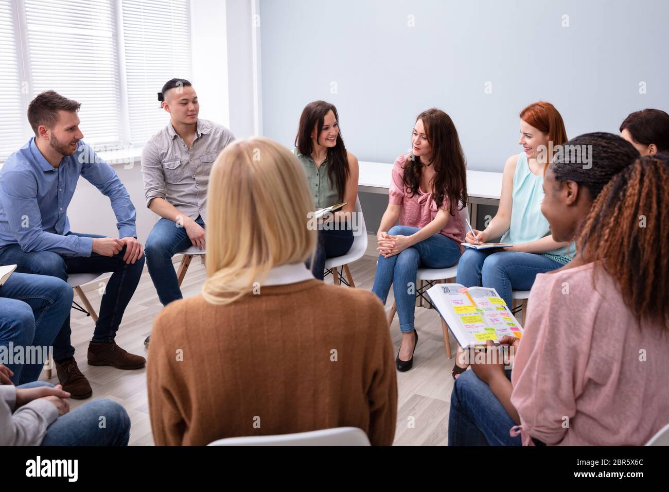 Group Of Multi-ethnic Friend Having Group Discussion Stock Photo - Alamy