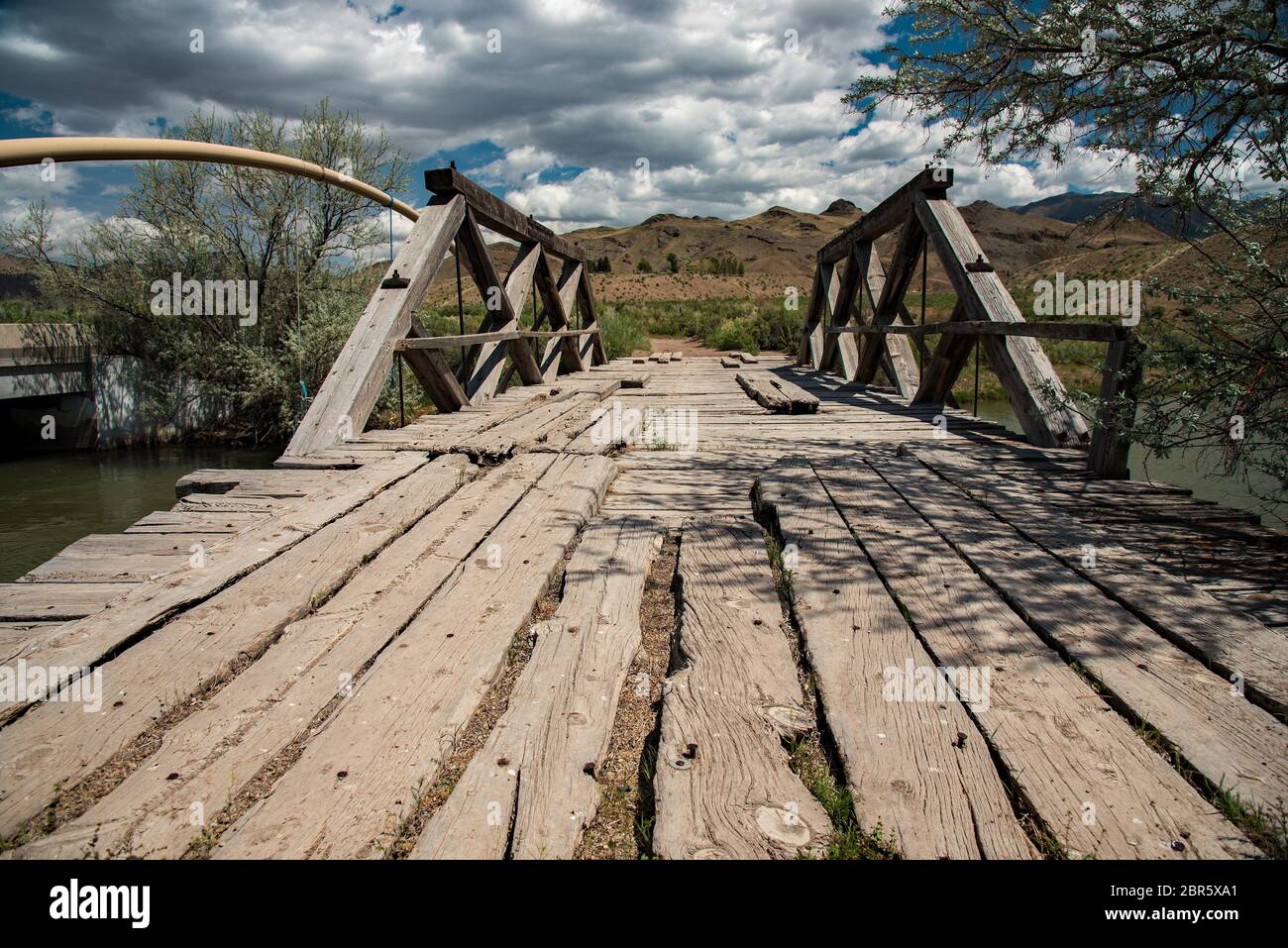 Old wooden bridge spans the Seveir River in southern Utah, USA. The old ...