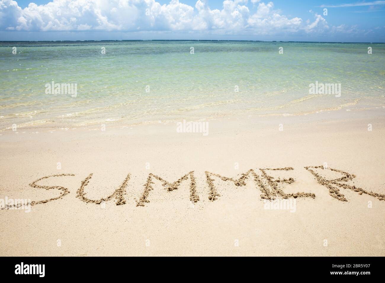 Summer Written Text On Sand Near The Idyllic Sea At Beach Stock Photo ...