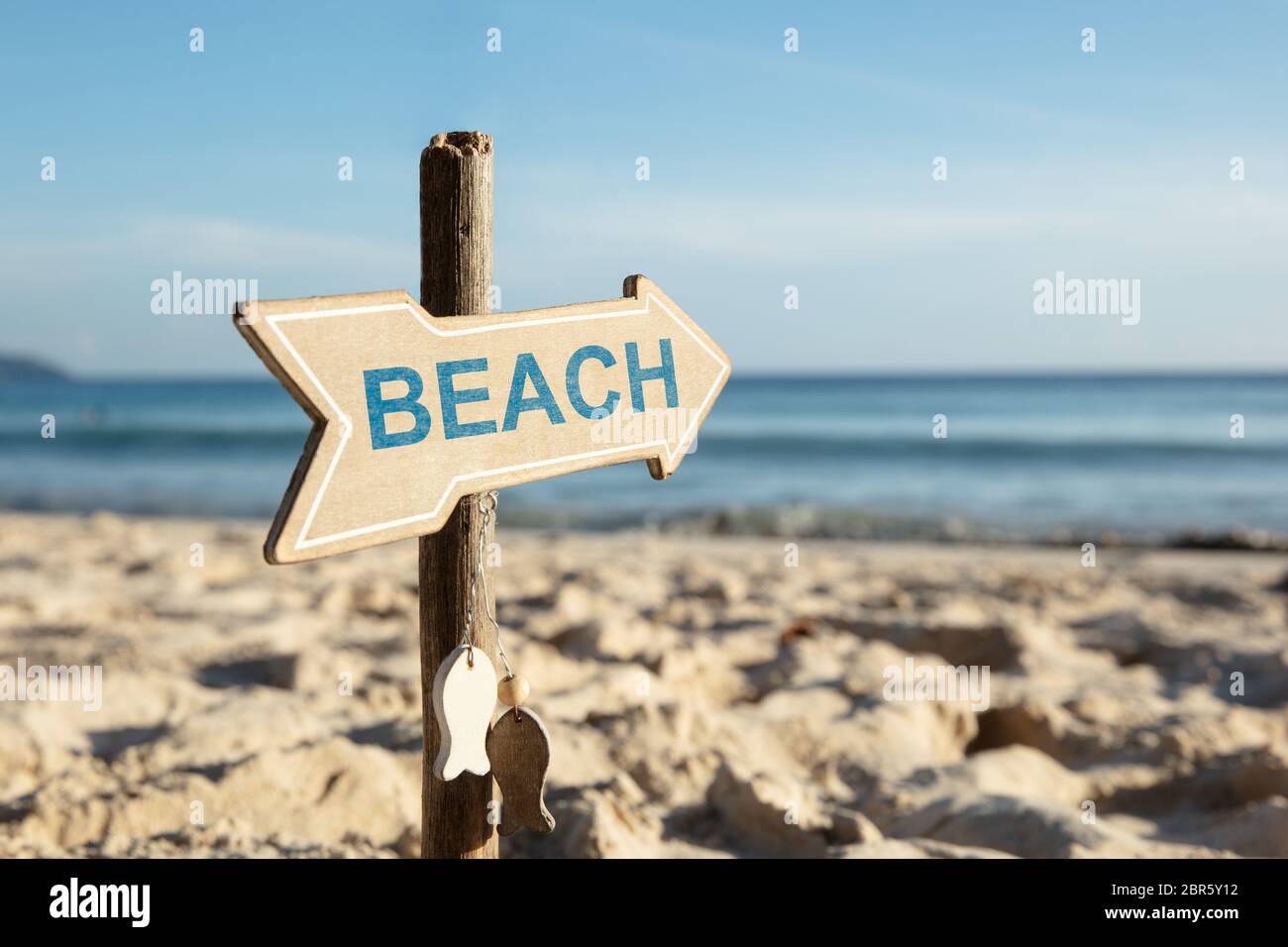 Beach Directional Sign Pole On Sand In Front Of Idyllic Sea Stock Photo ...