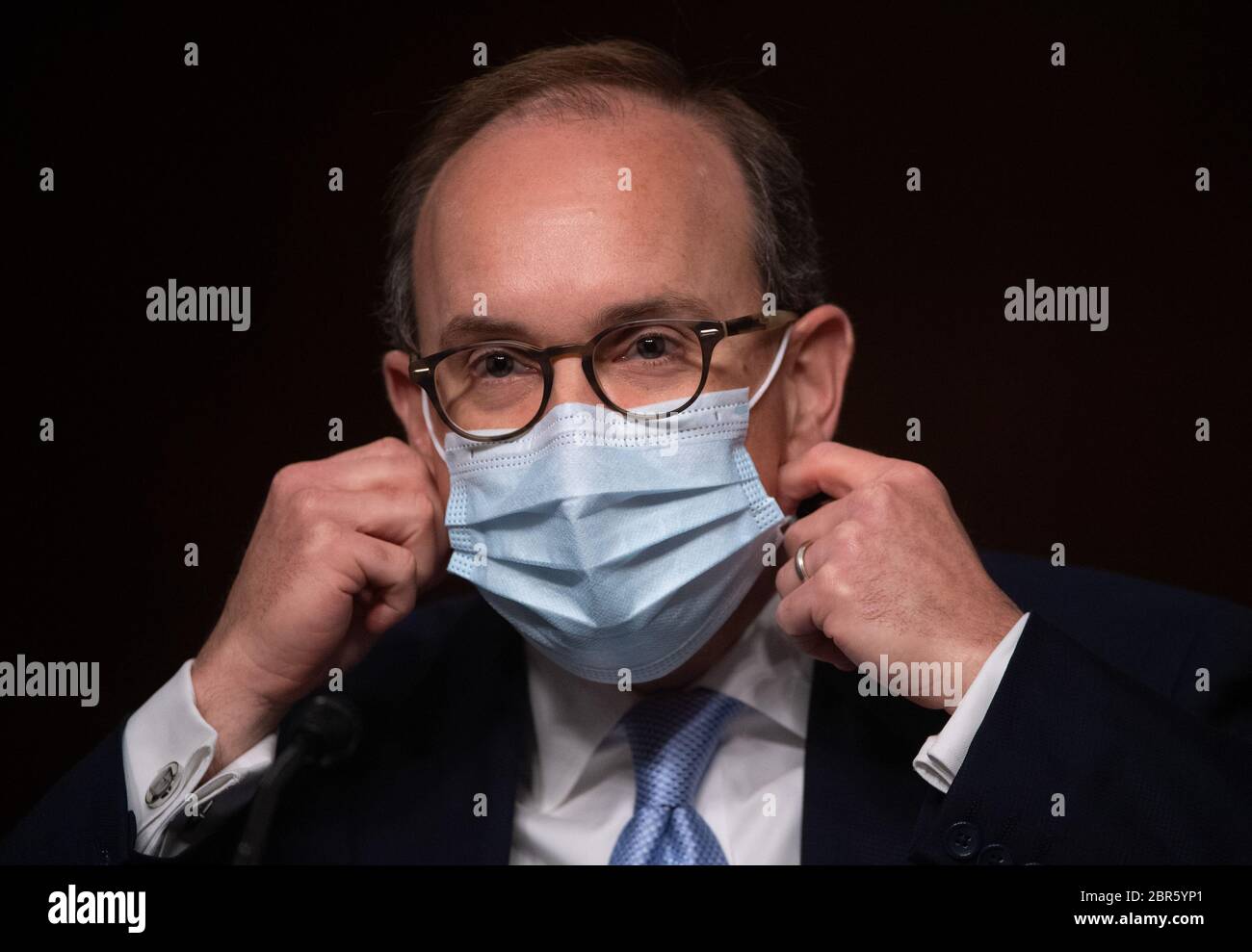 Washington, Untied States. 20th May, 2020. Cory Wilson takes his mask ...