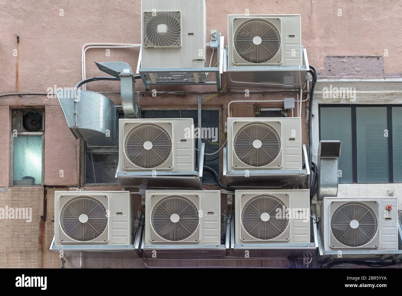 Many Air Conditioner Units at Building Exterior Stock Photo - Alamy