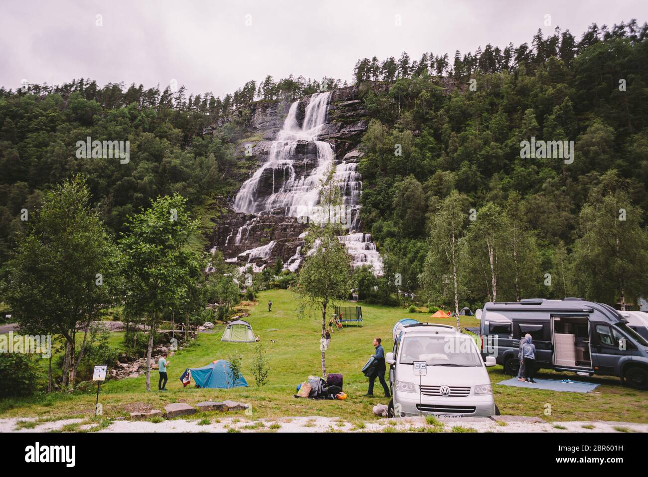 Tvinde Camping tents on the background of a waterfall Tvindefossen in ...