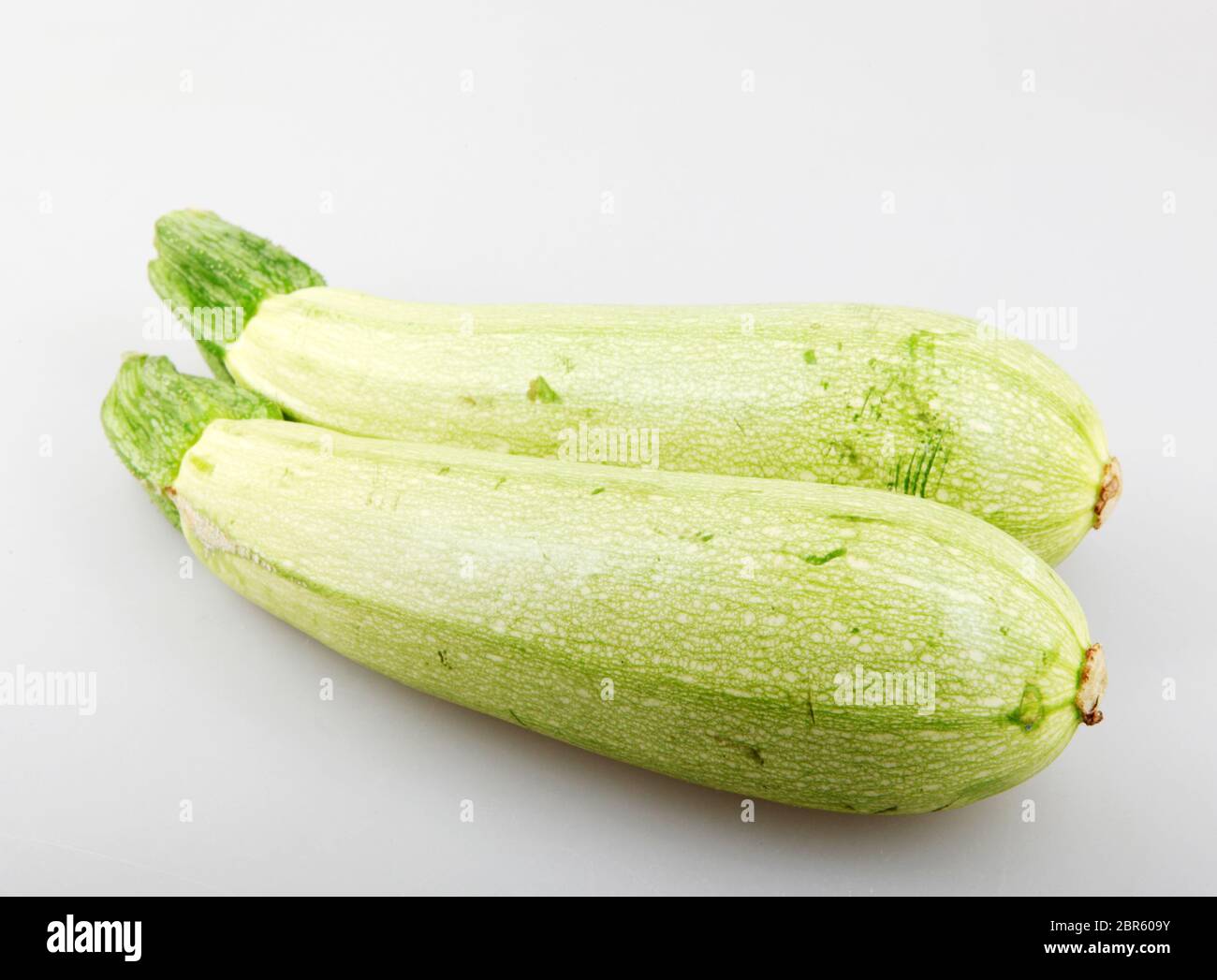 Fresh Vegetable Zucchini Against White Background Stock Photo - Alamy