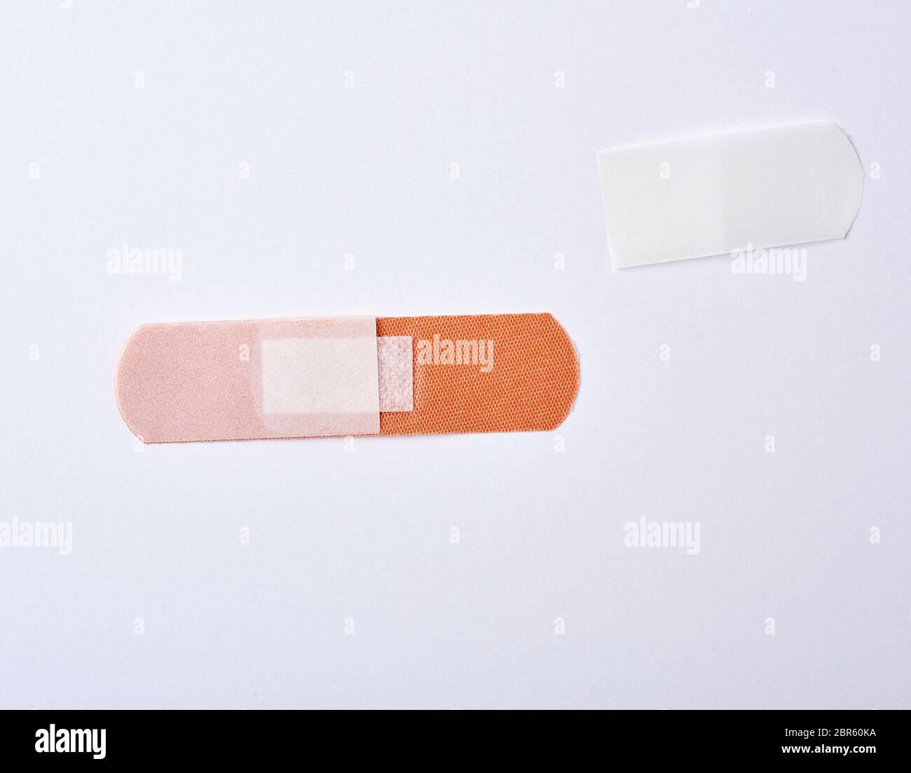 brown textile adhesive plaster for wounds on a white background Stock ...