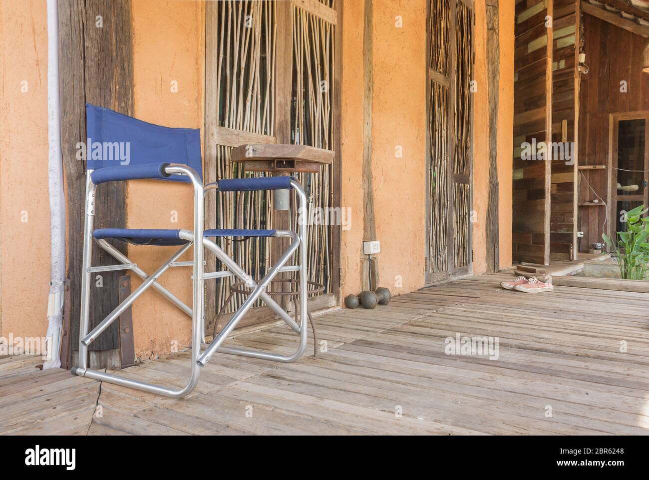 Folding Chair in front of Exterior Design House. Exterior design house ...