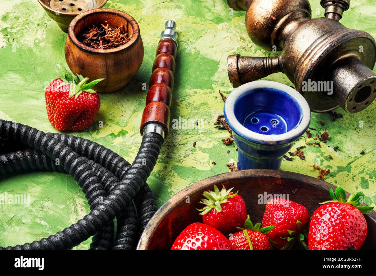 Oriental hookah with strawberry flavor.Turkish shisha with berry ...