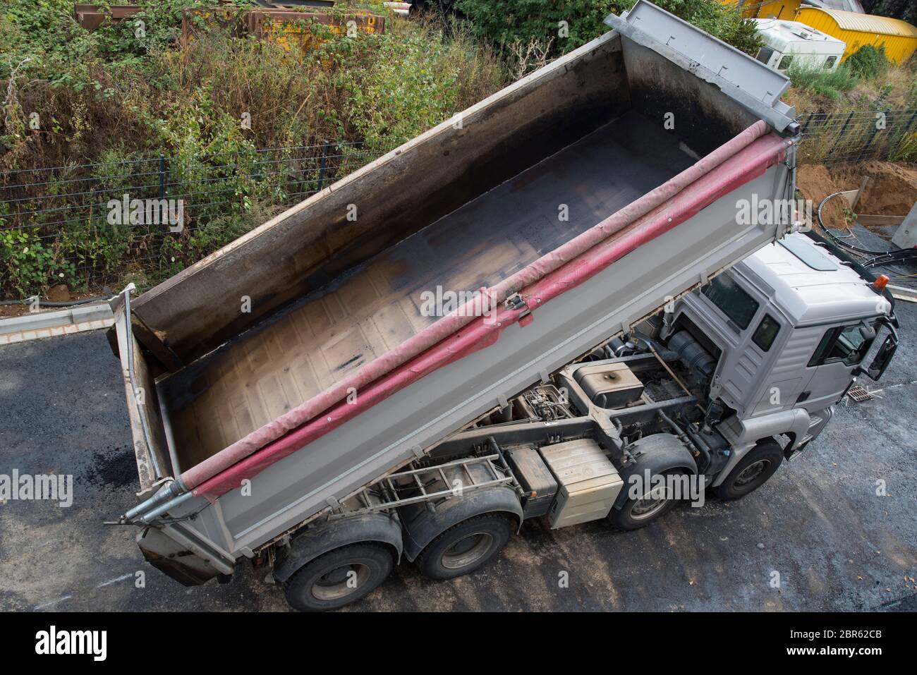 empty tipper after unloadind a load of asphalt Stock Photo - Alamy