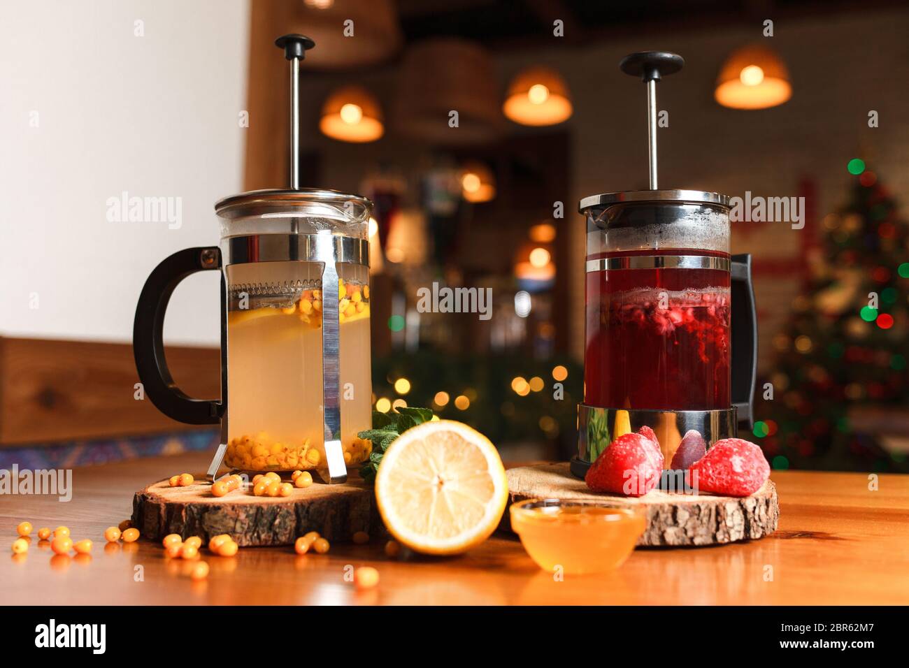 Many teapots with brewed fruit teas with different flavors. Natural ...
