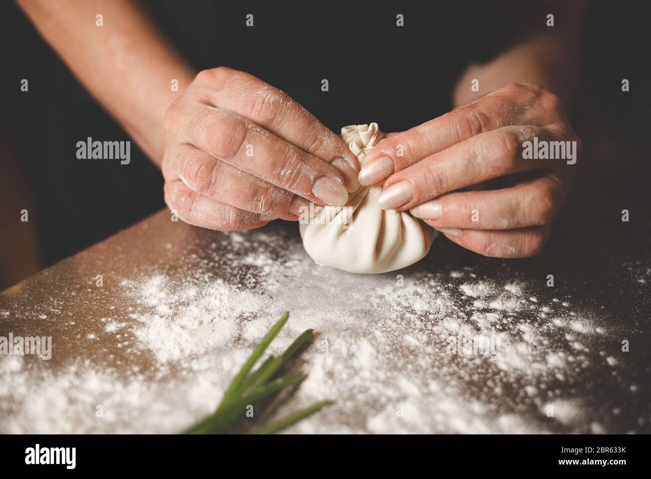Khinkali cooking process close up. Chef hands sculpt khinkali Stock ...