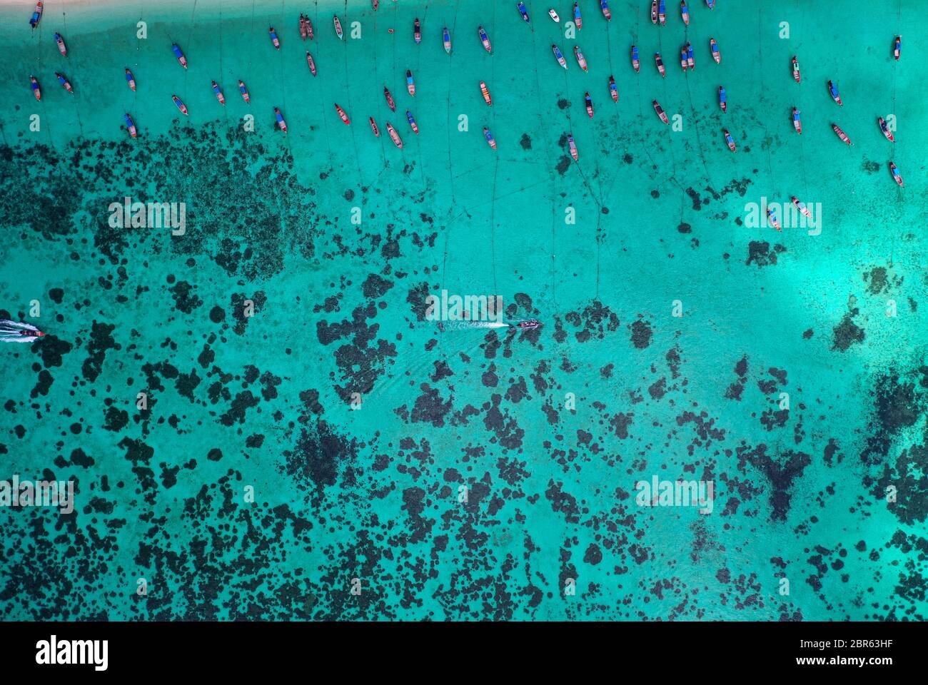 Aerial drone top view of crystal clear lagoon sea water with coral reef ...