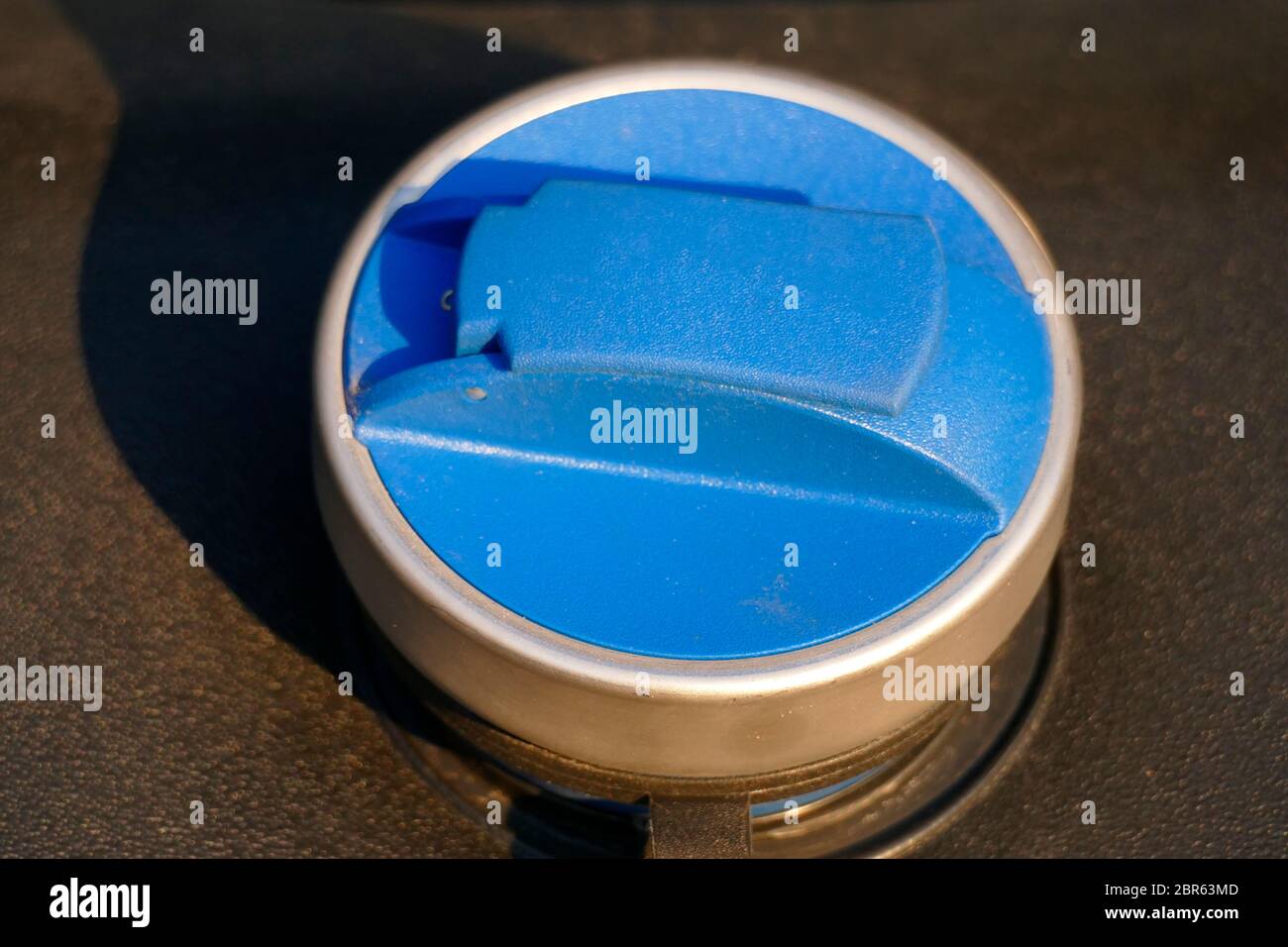 Blue gas cap from a truck Stock Photo - Alamy