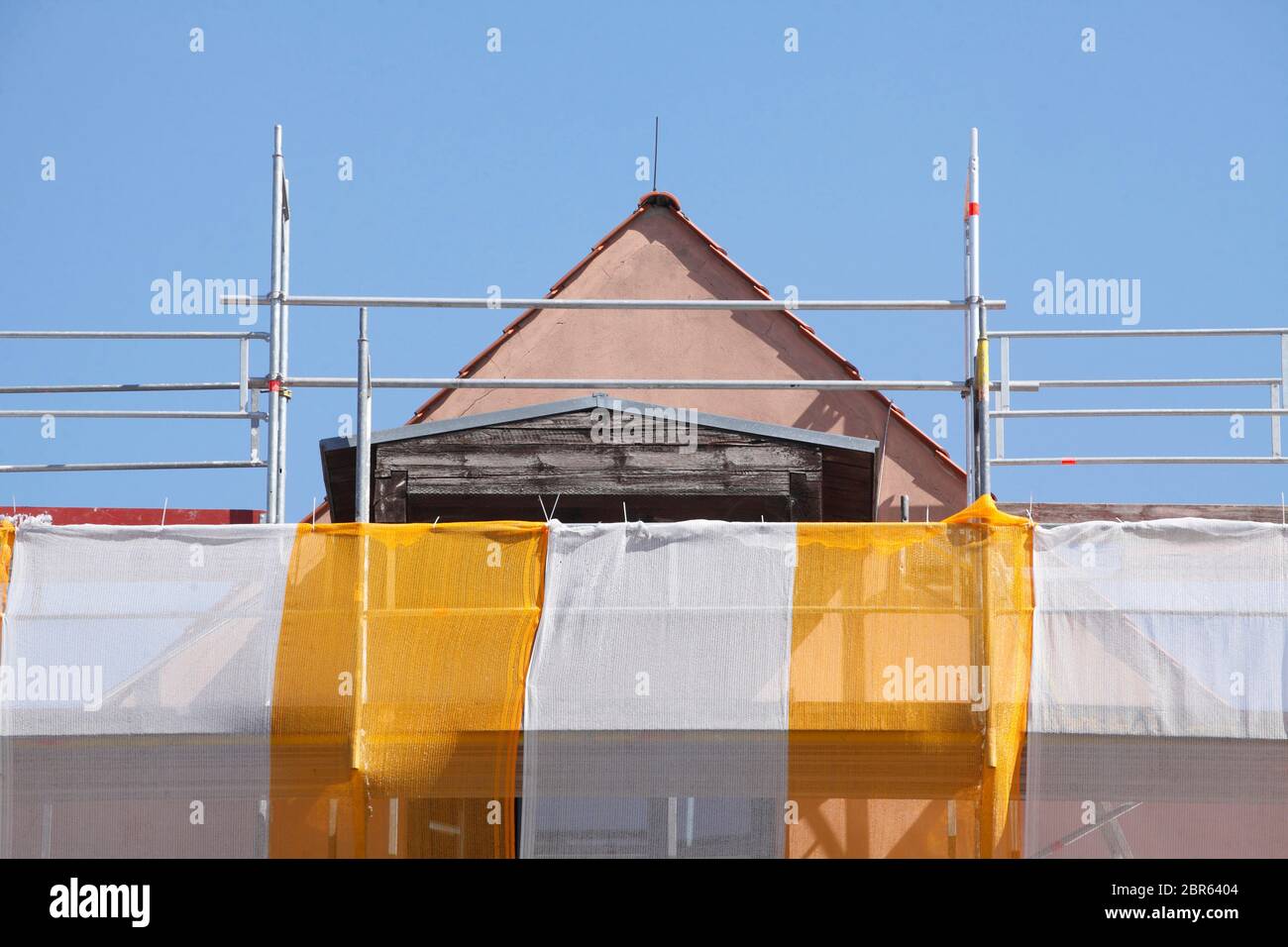 Orange-white tarpaulin, gable, scaffolding, construction site, house ...