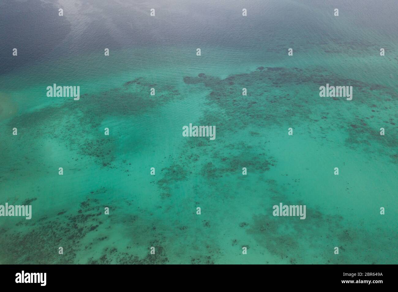 Aerial drone top view of the crystal clear lagoon sea water surface ...