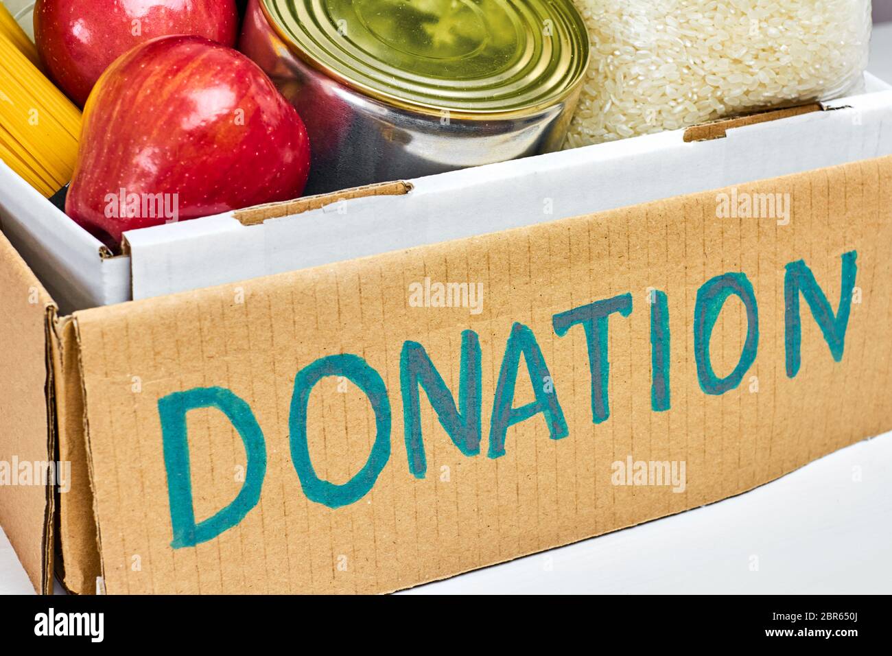 Close up a cardboard box with food for donation. Charity concept Stock ...