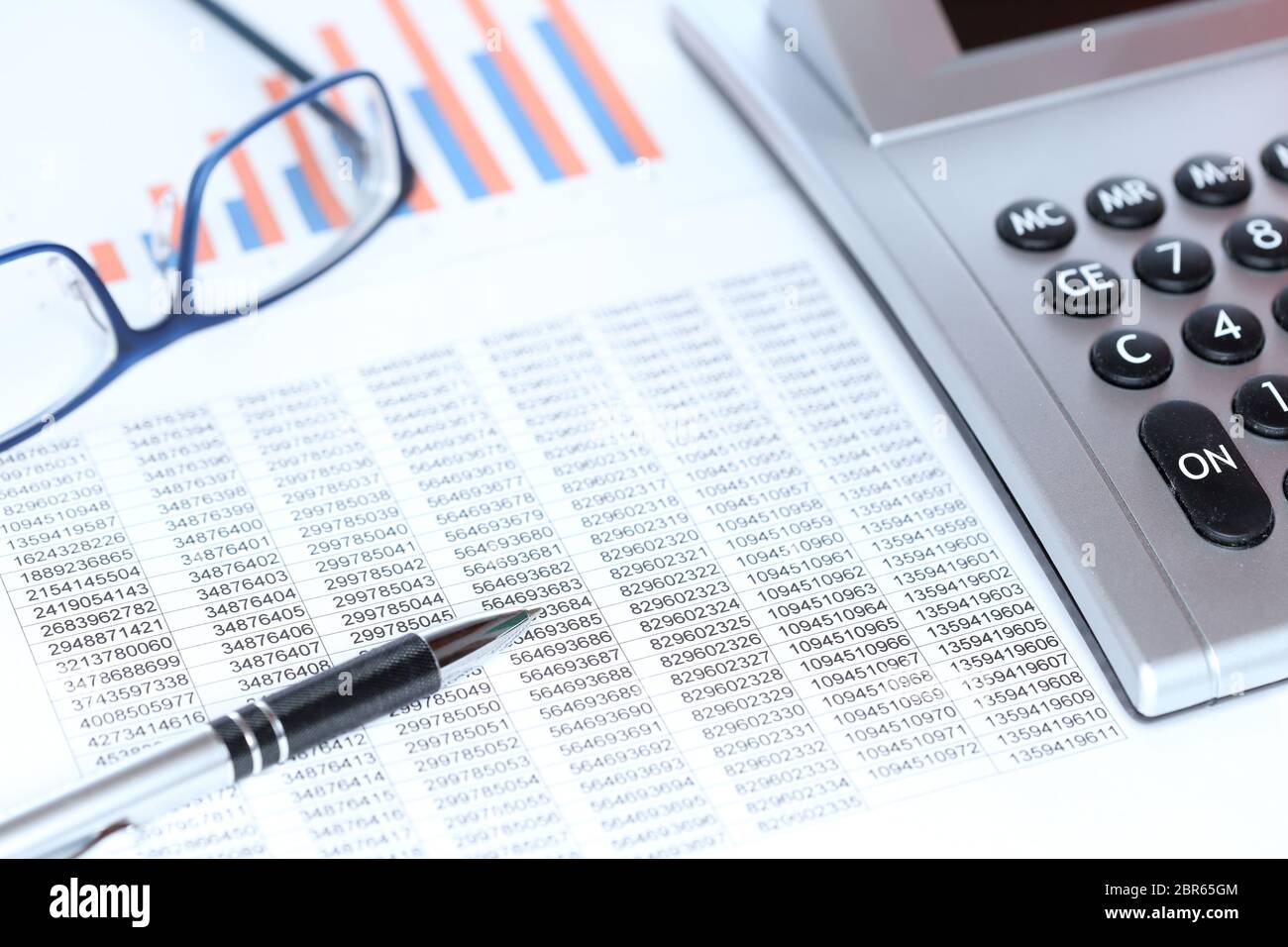 a report with graph on a workplace Stock Photo - Alamy