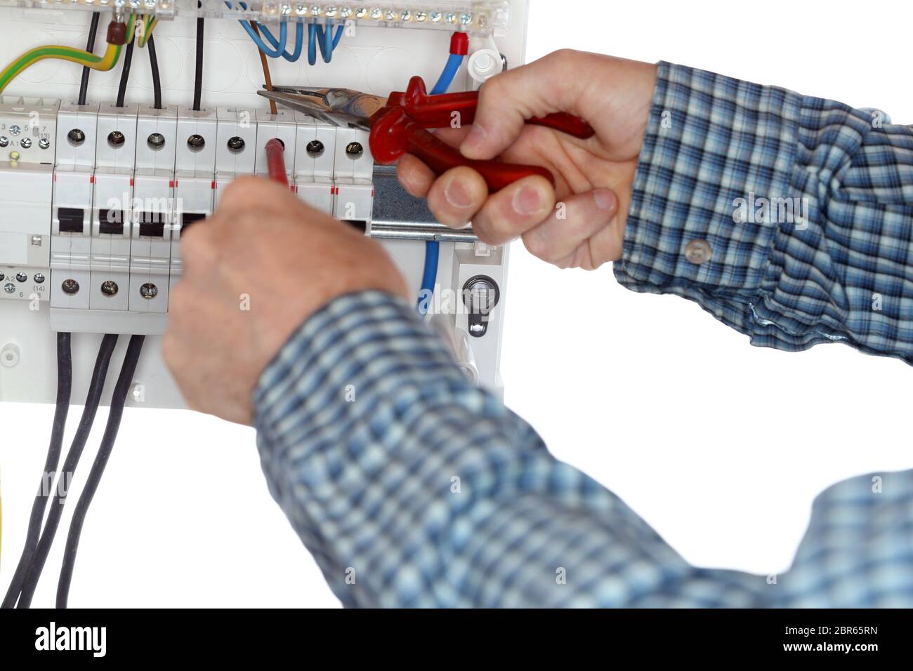 electrician is repairing an electrical device with tools Stock Photo ...
