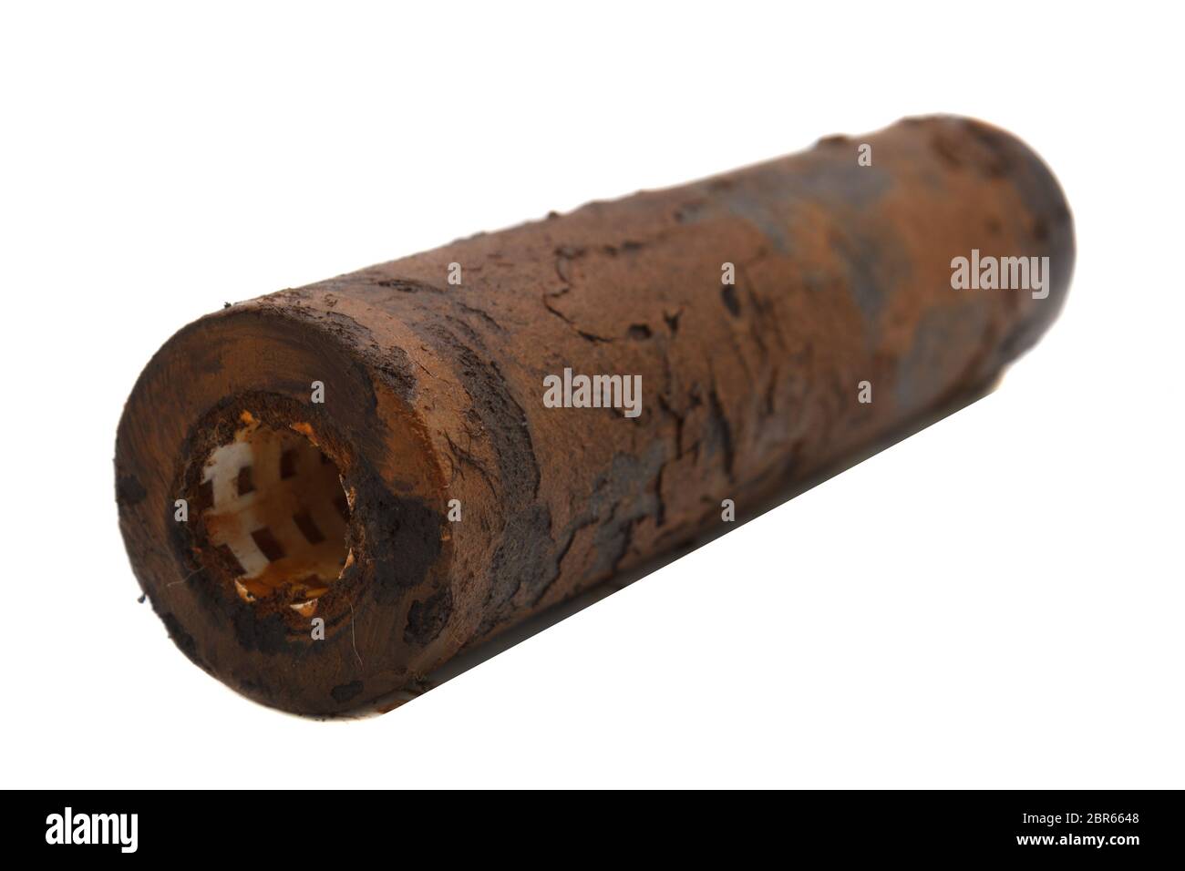 very dirty rusty water filter on white background Stock Photo - Alamy