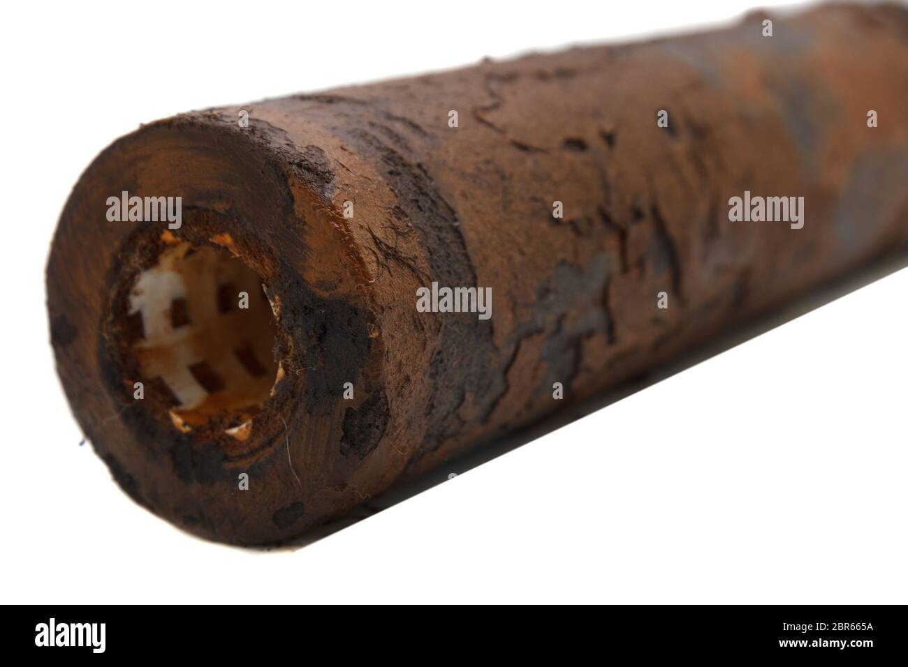 very dirty rusty water filter on white background Stock Photo - Alamy