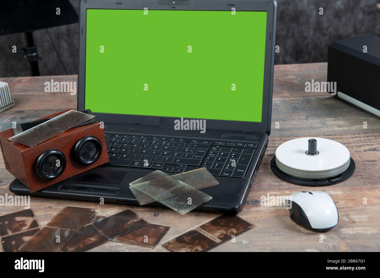 digitizing old photography on glass plate with laptop, a green screen ...